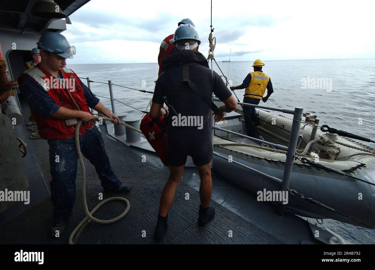 US Navy Sailors aboard the guided missile cruiser USS Thomas S. Gates ...