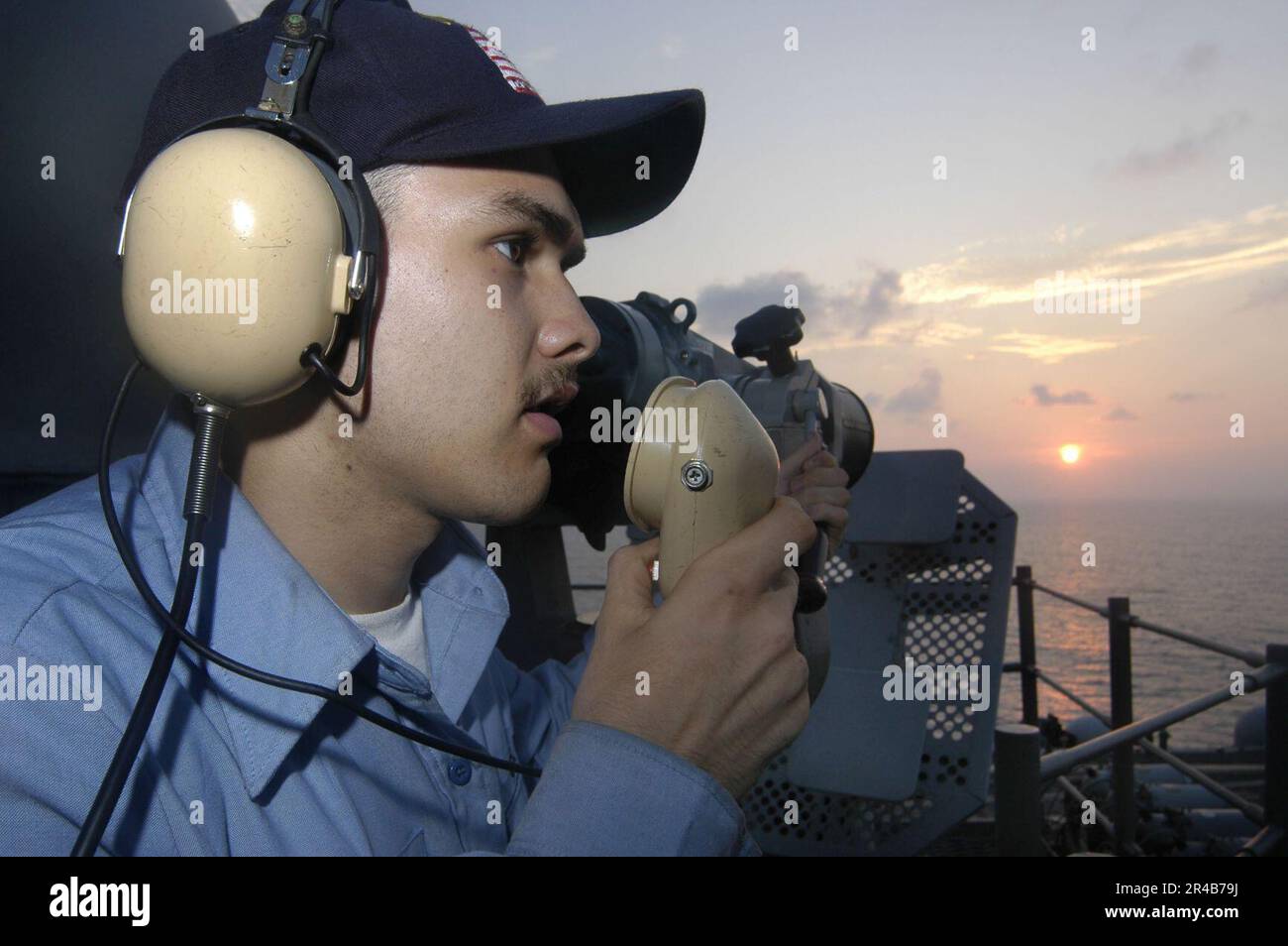 US Navy Seaman stands the forward lookout watch on the signal bridge ...