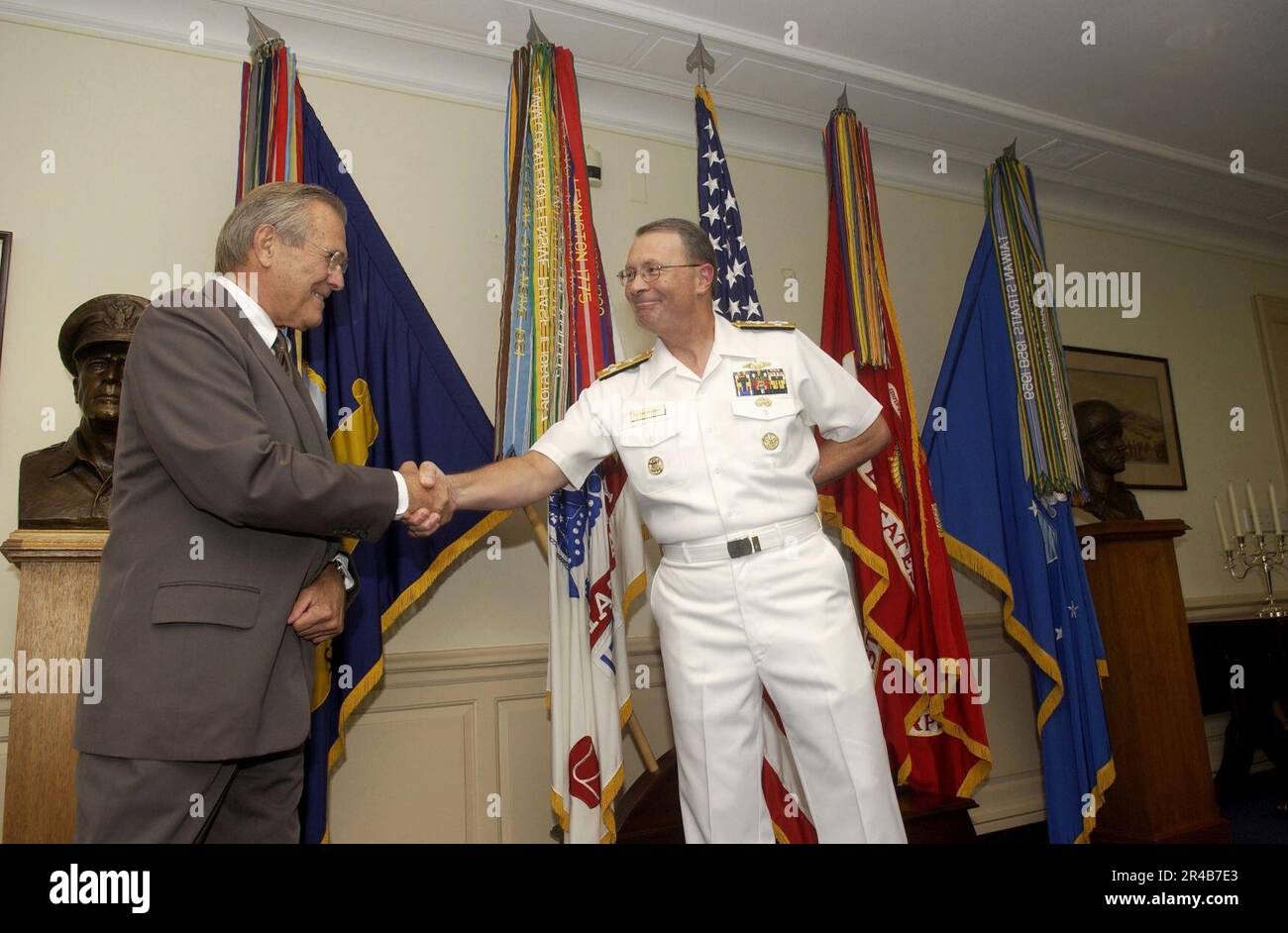 US Navy Secretary of Defense Donald H. Rumsfeld, left, congratulates U ...
