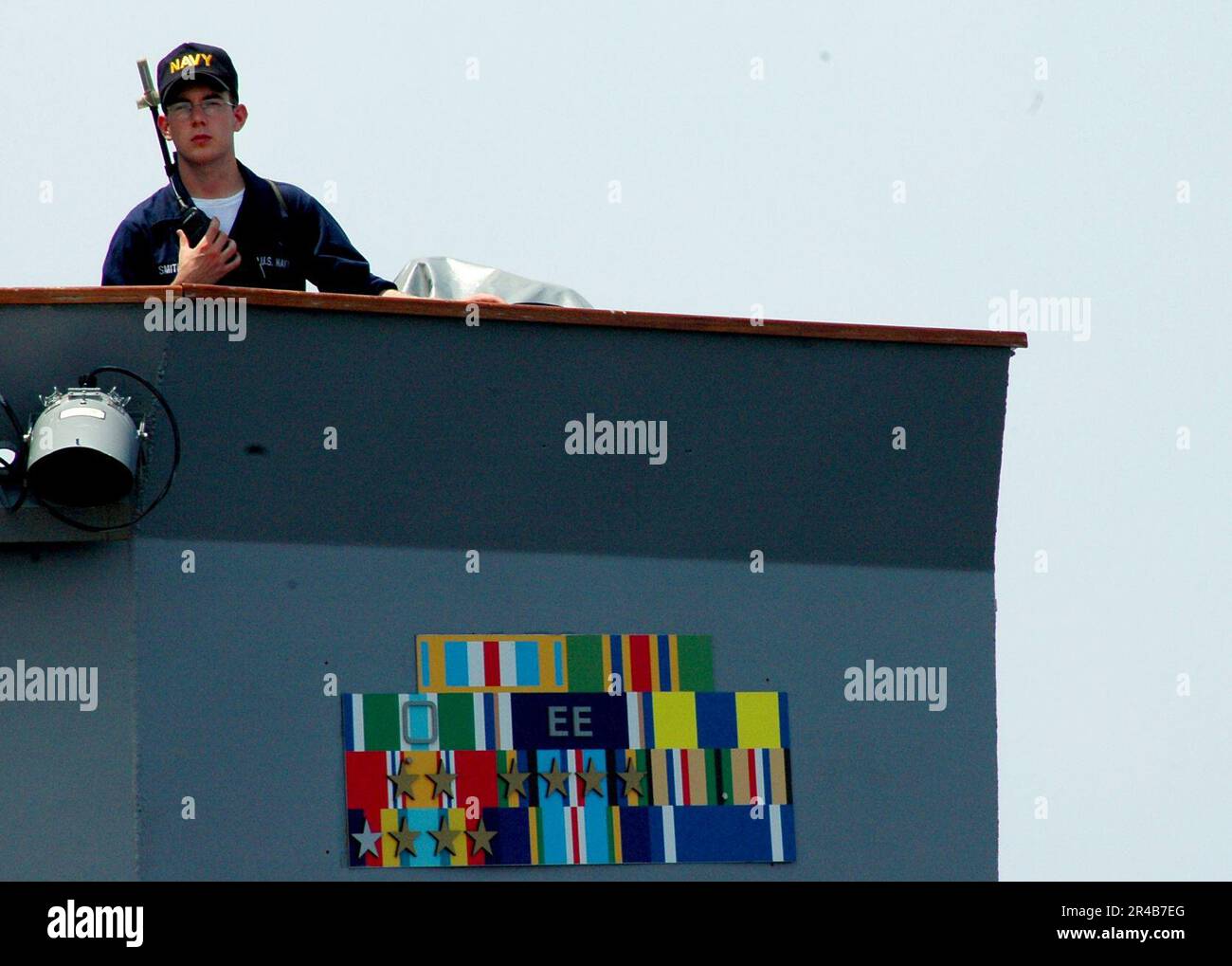US Navy Hospital Corpsman stands watch on the bridge aboard the guided ...