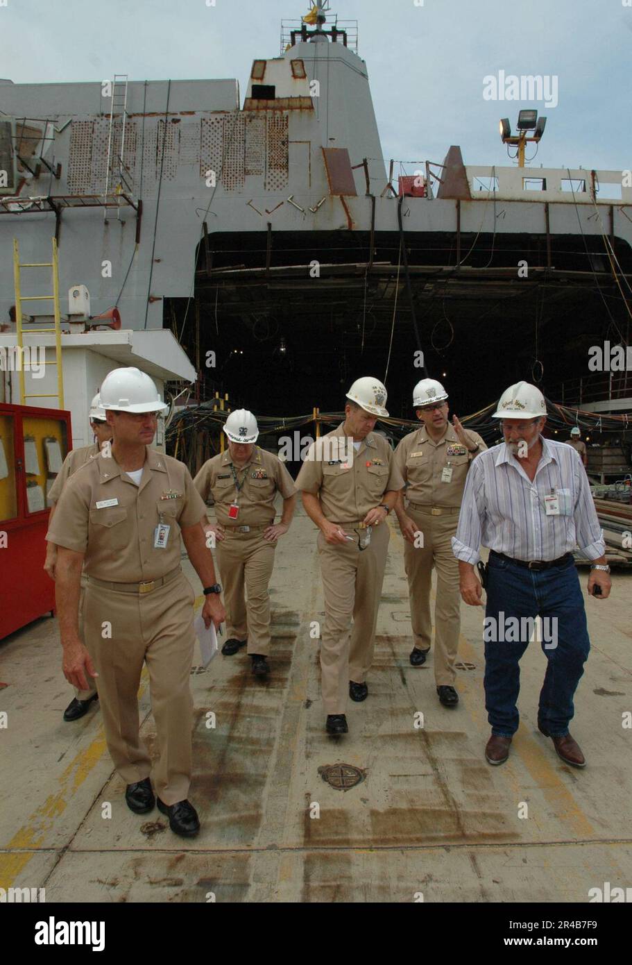 US Navy Chief of Naval Operations Adm. Mike Mullen, center, listens to ...