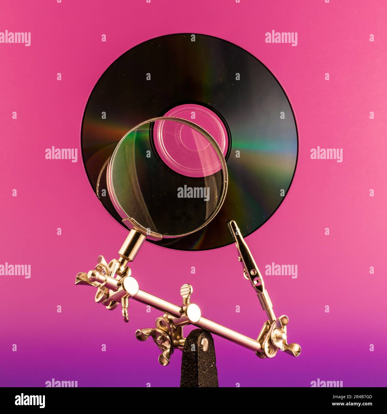 Concept for data analysis, CD and lens on a vivid colors background ...