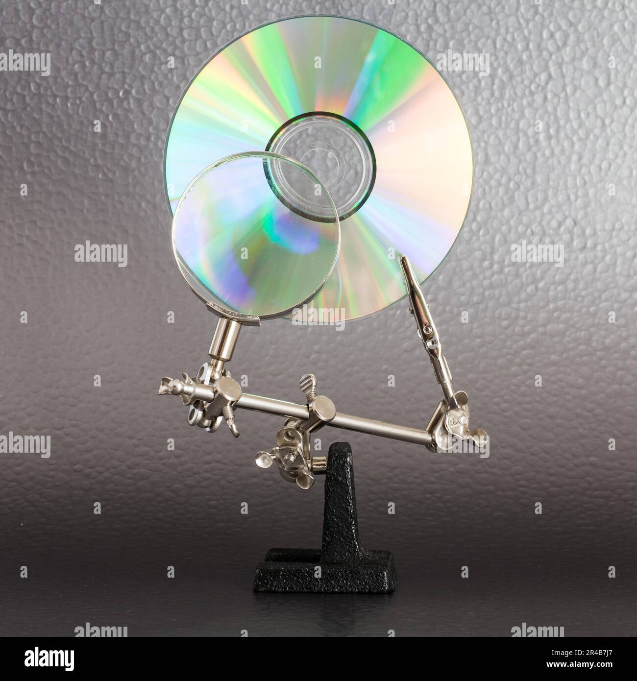 Concept for data analysis, CD and lens on a vivid colors background ...