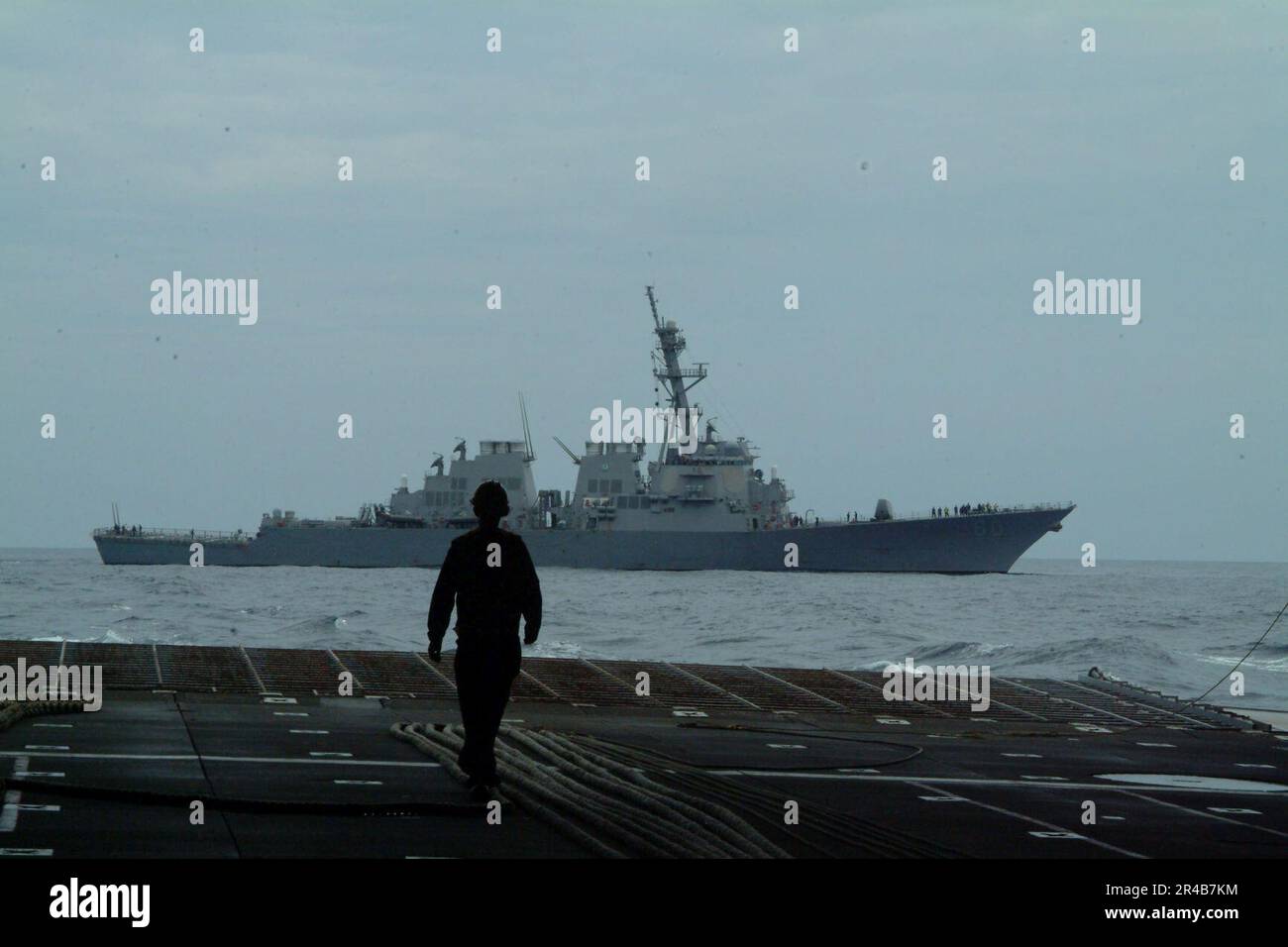 US Navy A Sailor walks in the well deck of the amphibious dock landing ...