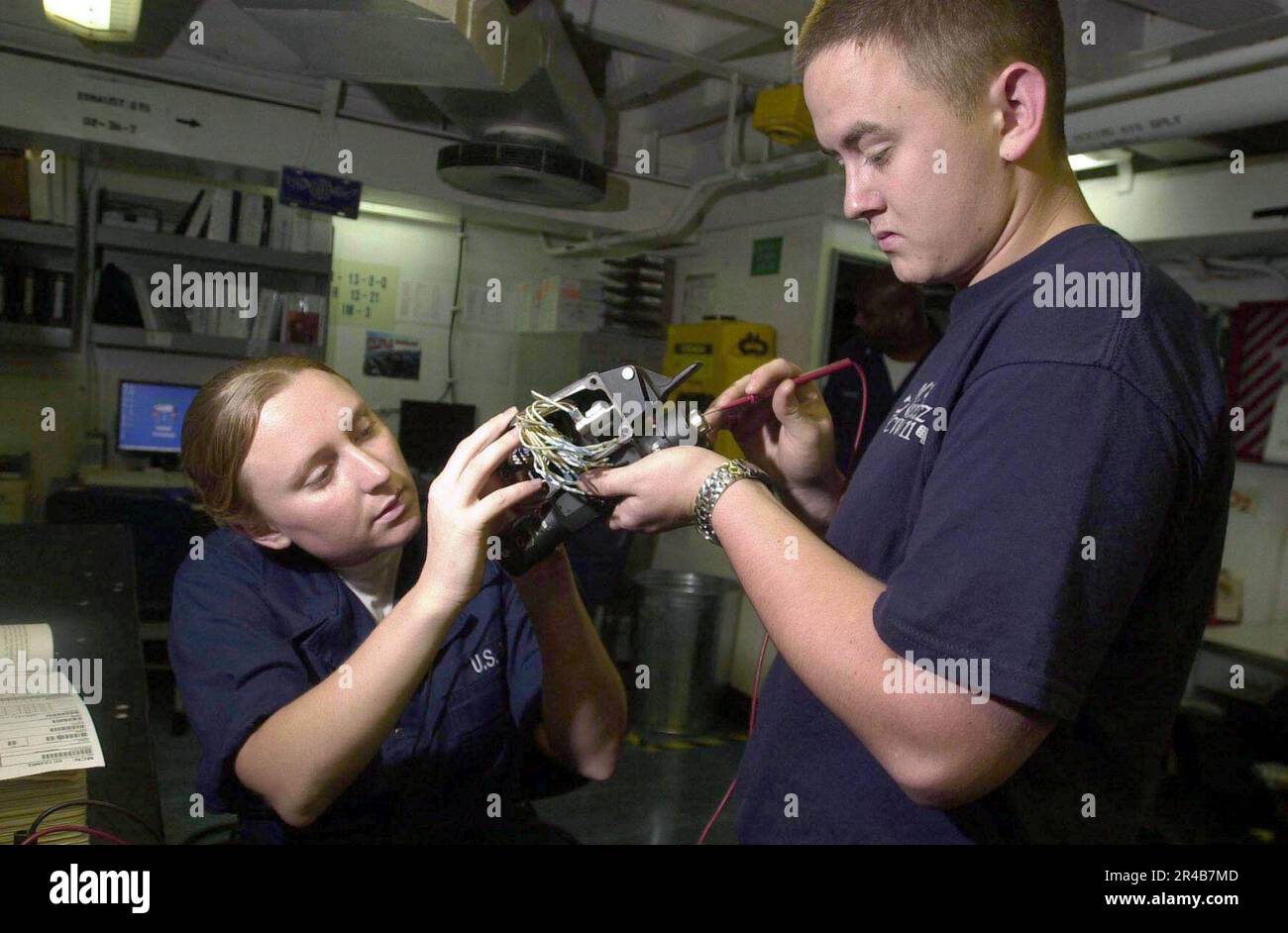 US Navy Aviation Electrician's Mate test the internal wiring of a ...
