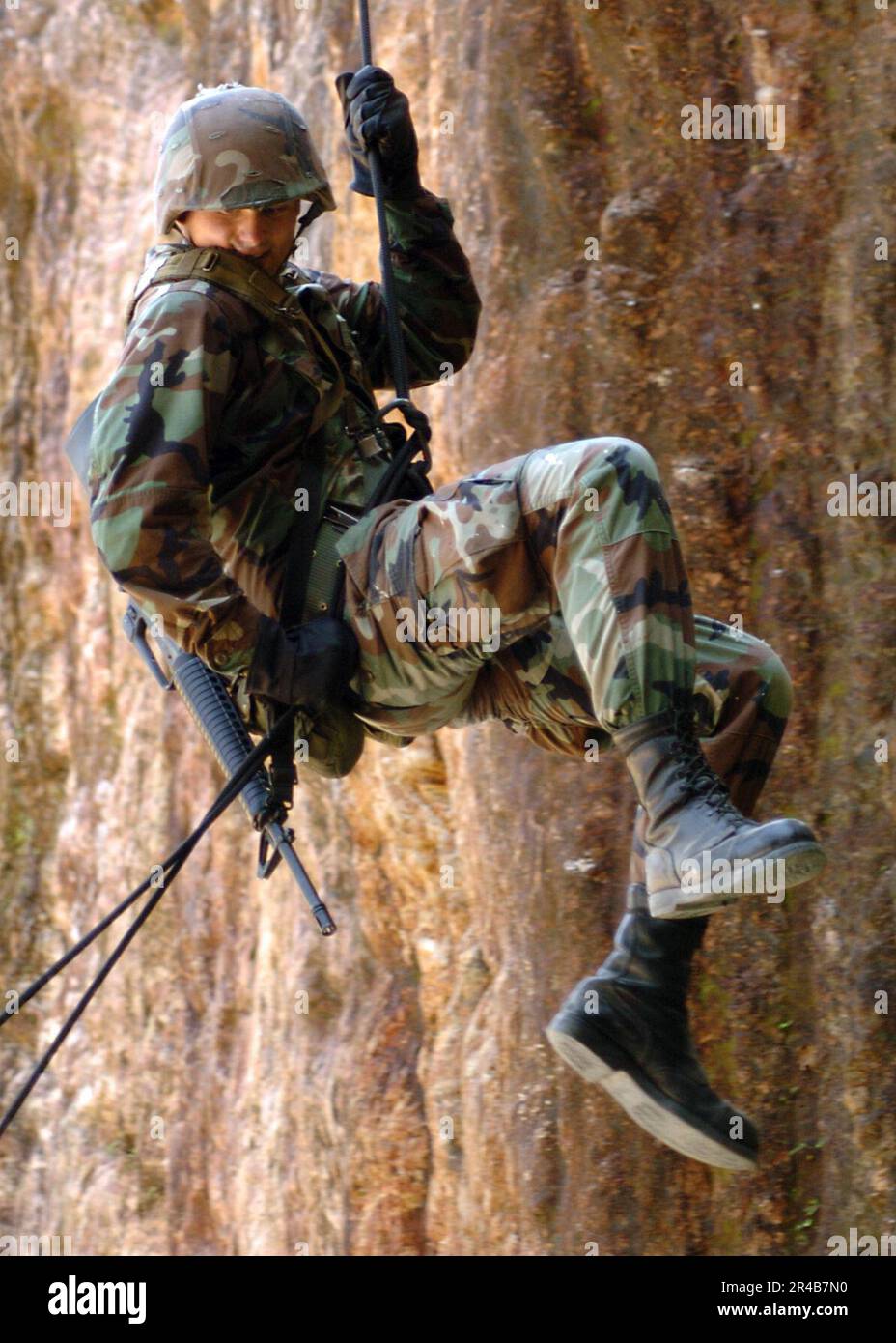 US Navy U.S. Navy Construction Electrician 3rd Class repels down a 65 ...