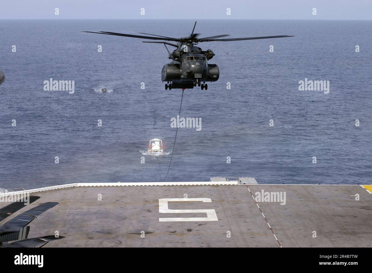 US Navy An MH-53E Sea Dragon helicopter tows a MK-105 Magnetic ...