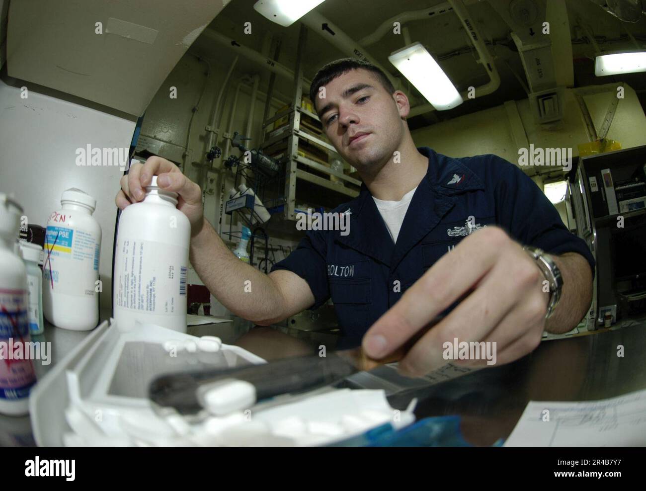 US Navy Hospital Corpsman 3rd Class fills a prescription for a patient ...