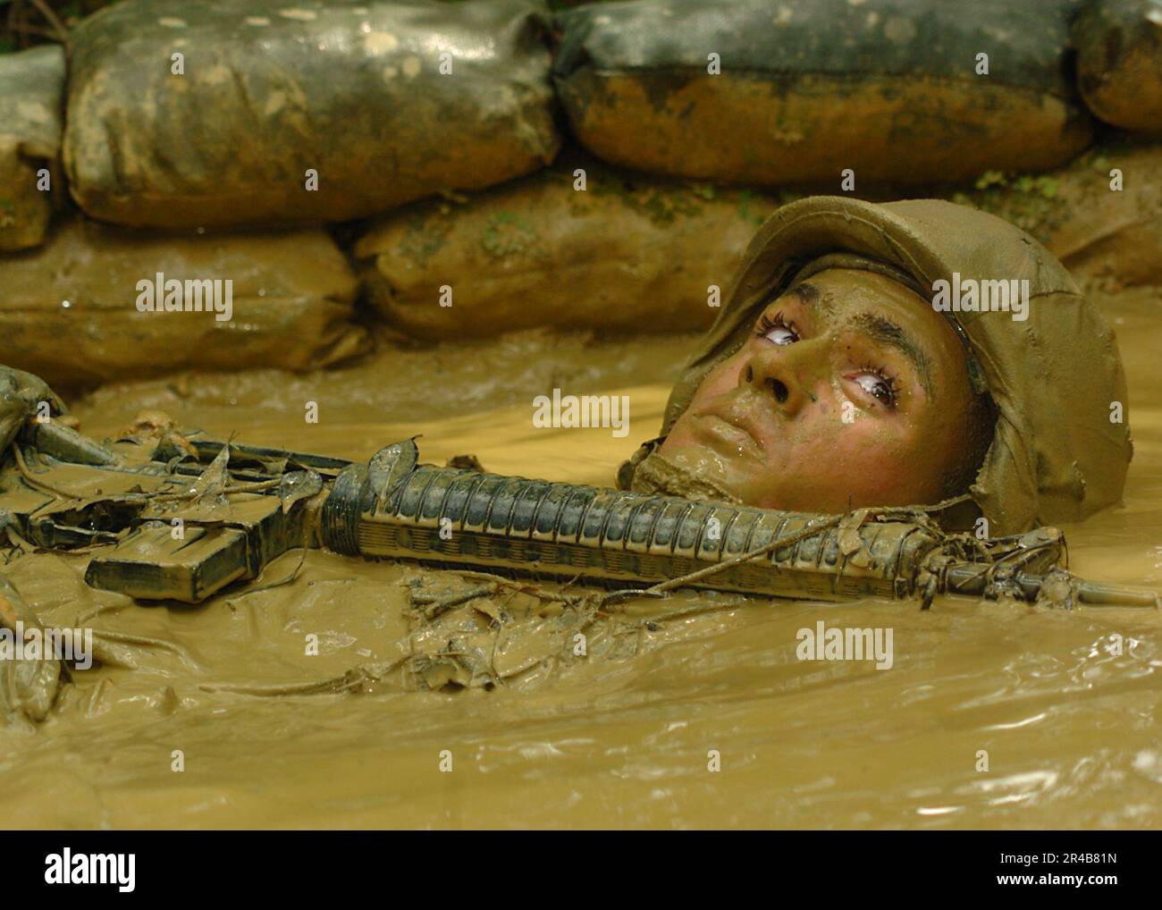 US Navy U.S. Navy Construction Mechanic 3rd Class back crawls through ...