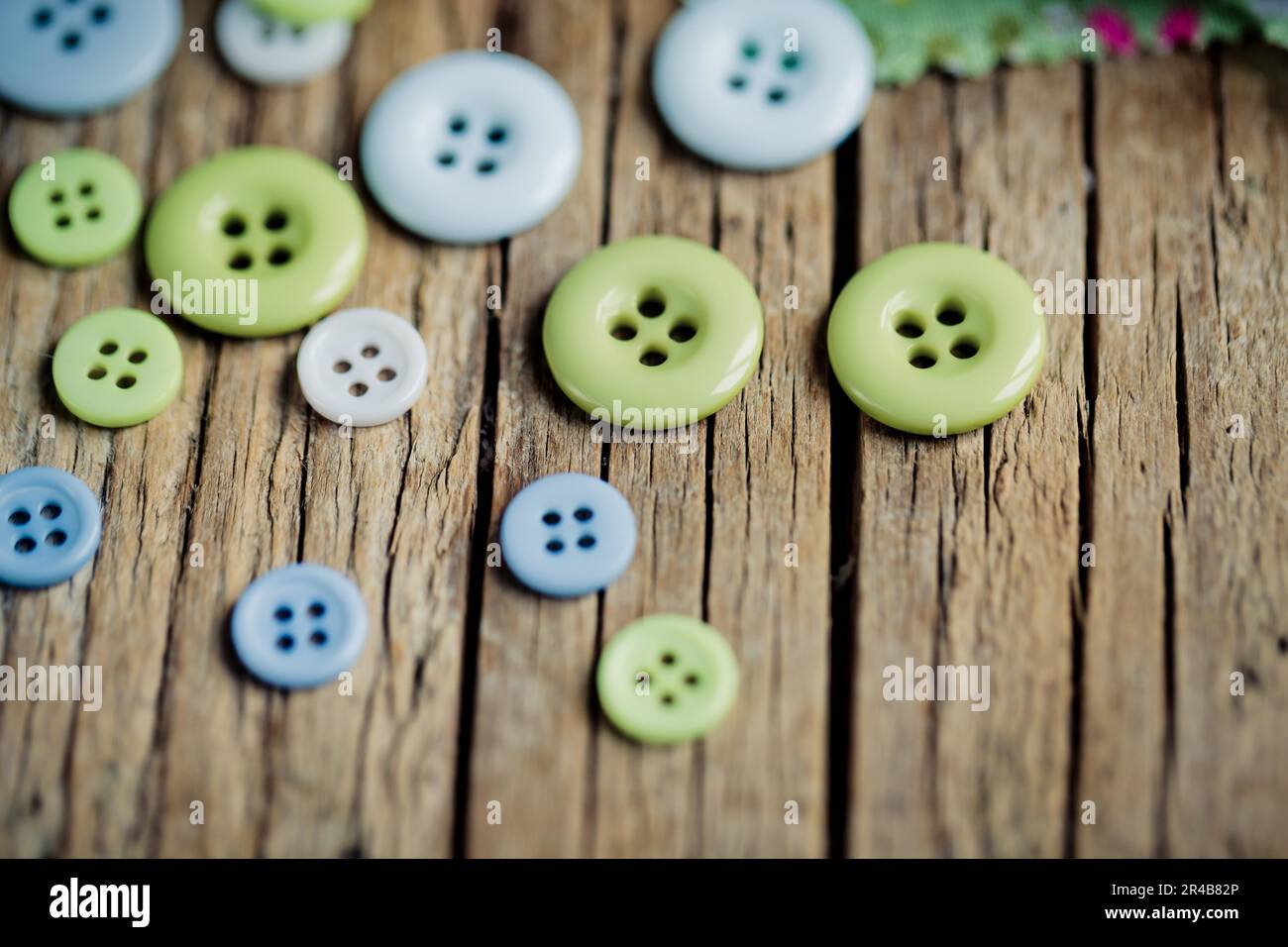 Pastel coloured buttons in different sizes in blue and green Stock ...