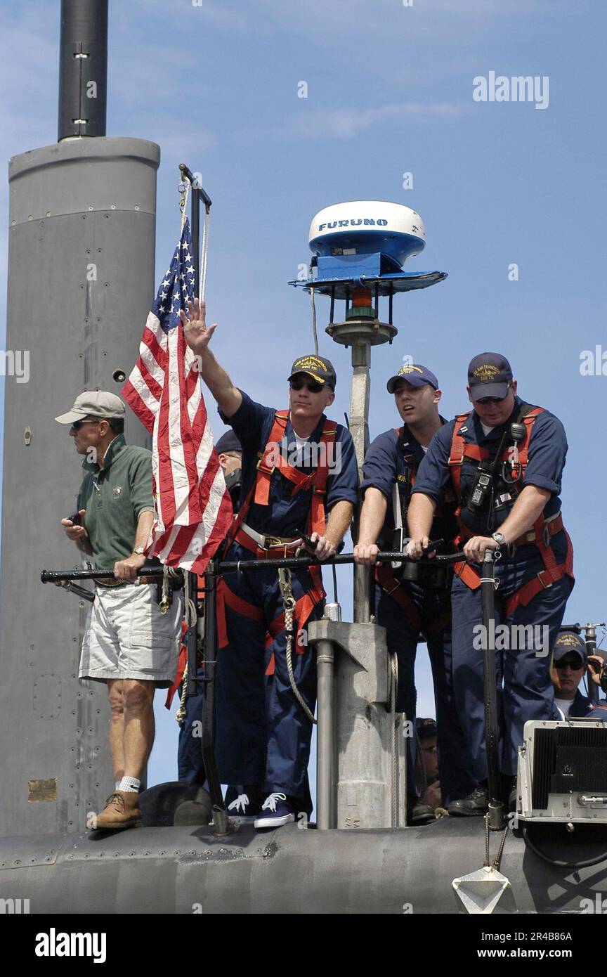 US Navy Commanding Officer, USS San Francisco (SSN 711), Cmdr. waves ...