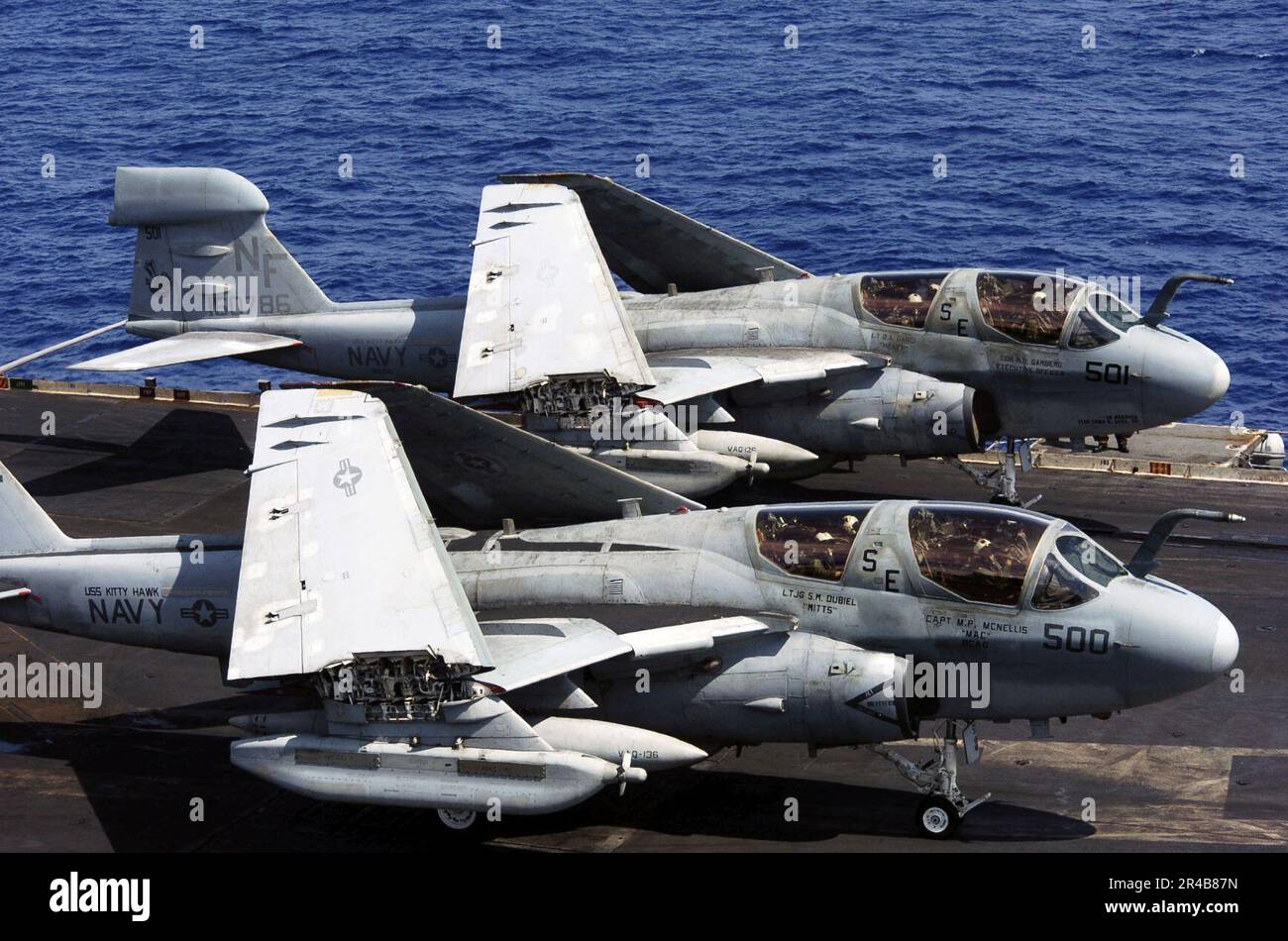US Navy Two EA-6B Prowlers wait to be launched off the flight deck of ...