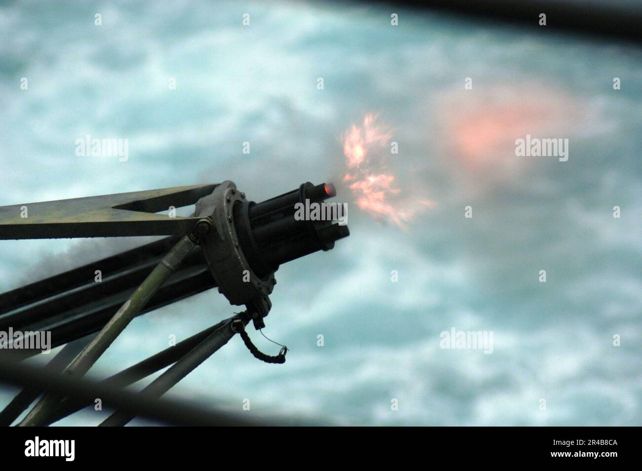 US Navy Fire protrudes from the barrels of a Close In Weapon System ...