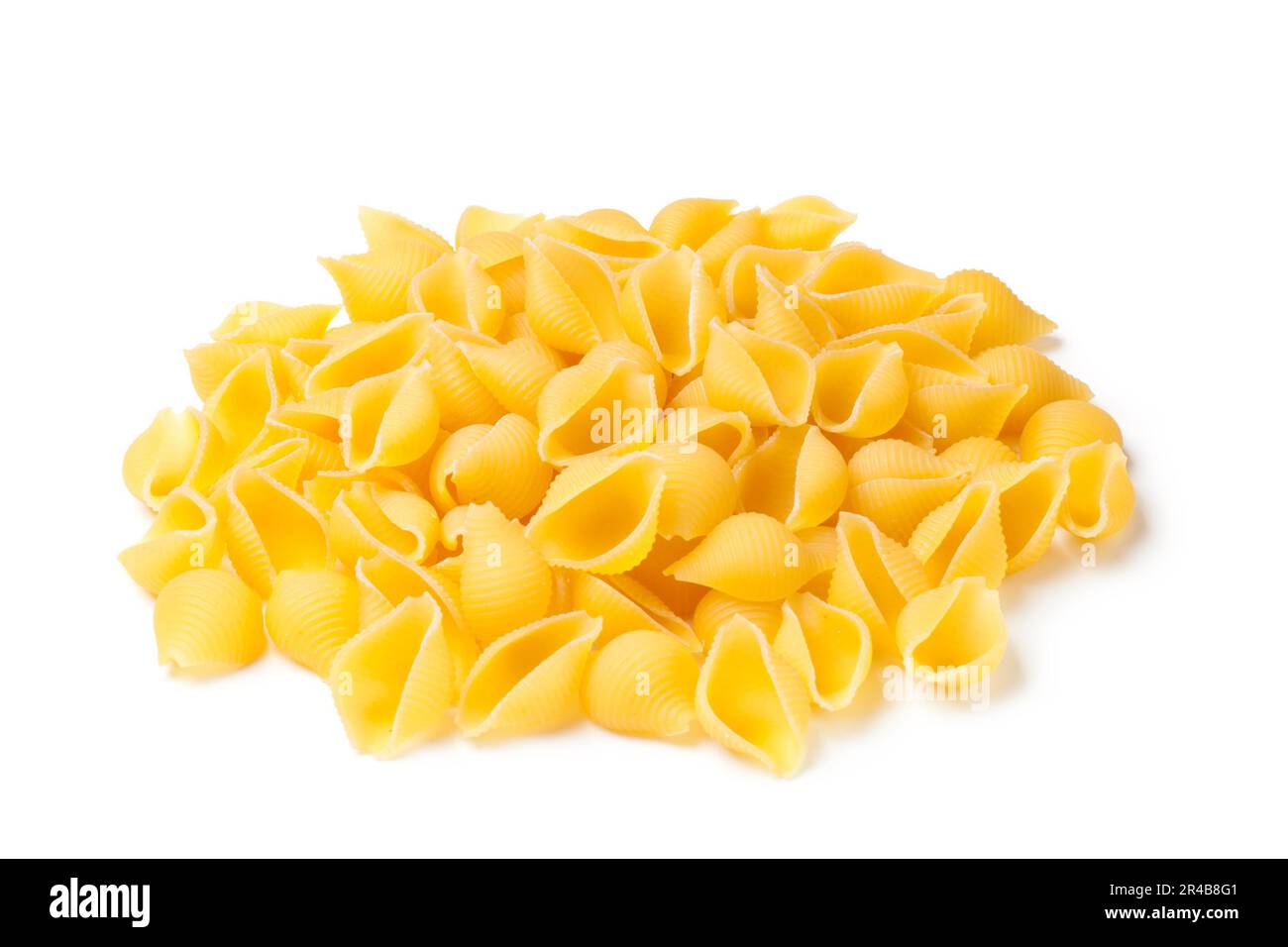 conchiglie pasta, isolated on a white background Stock Photo - Alamy