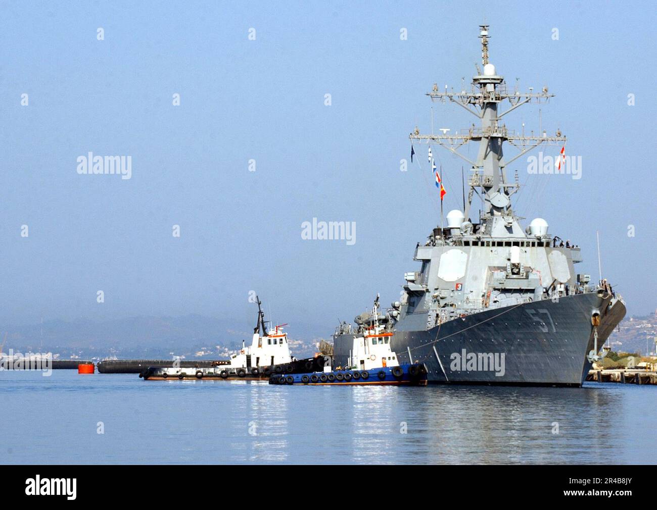 US Navy Tugs assist the guided missile destroyer USS Mitscher (DDG 57 ...