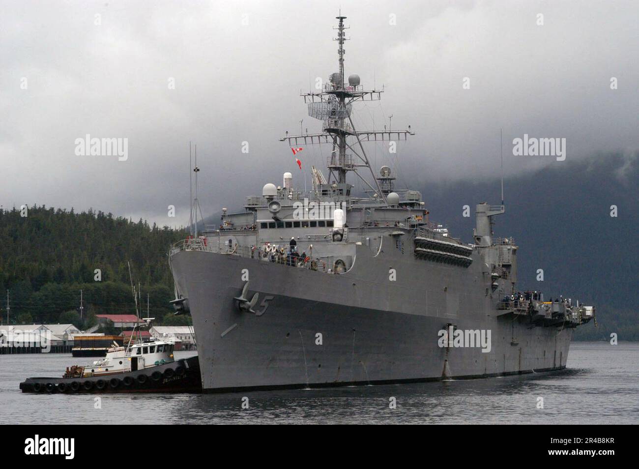 US Navy The amphibious transport dock USS Ogden (LPD 5) is assisted by ...