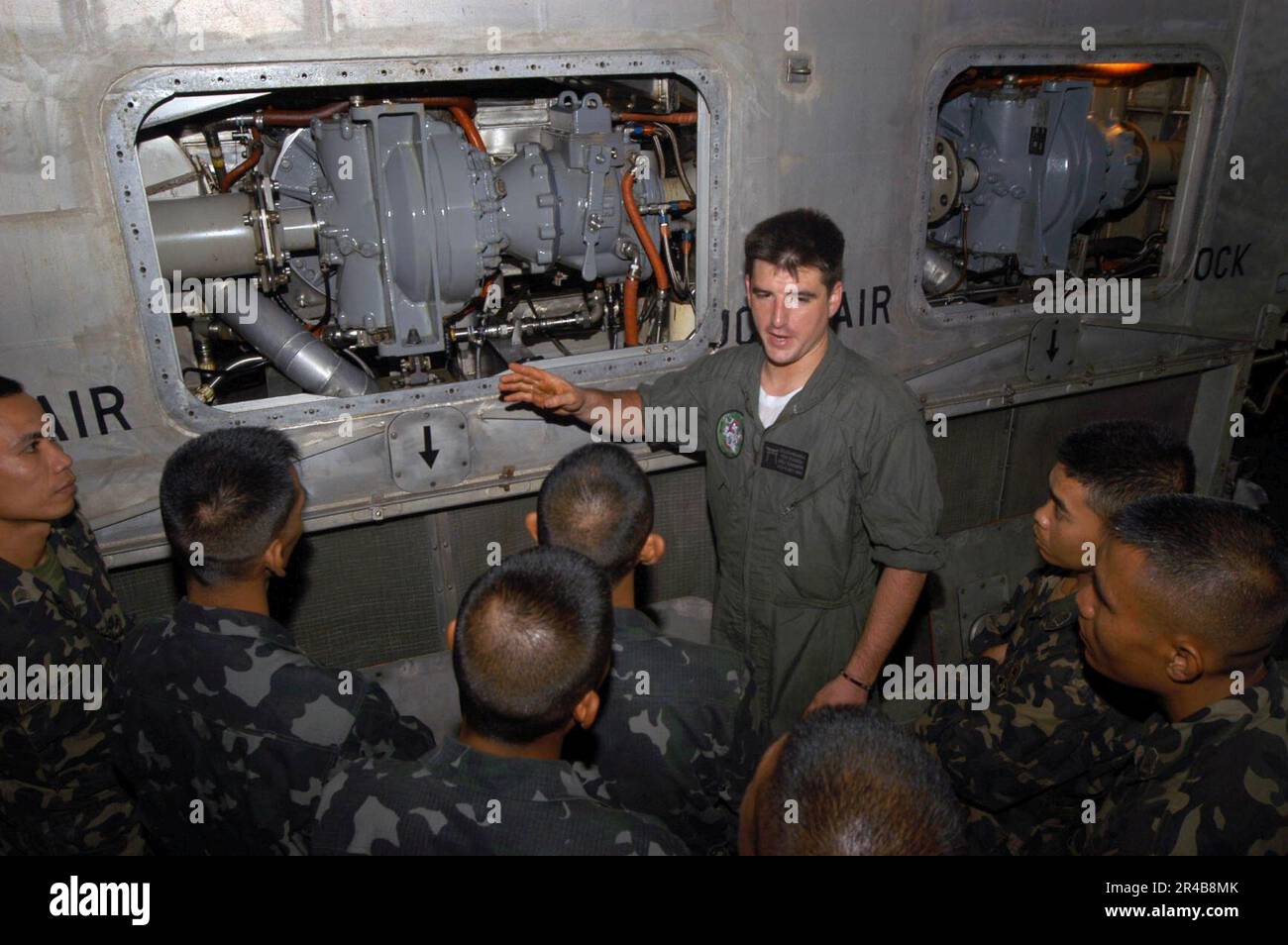 US Navy Gas Turbine Systems Technician 3rd Class explains to Philippine ...