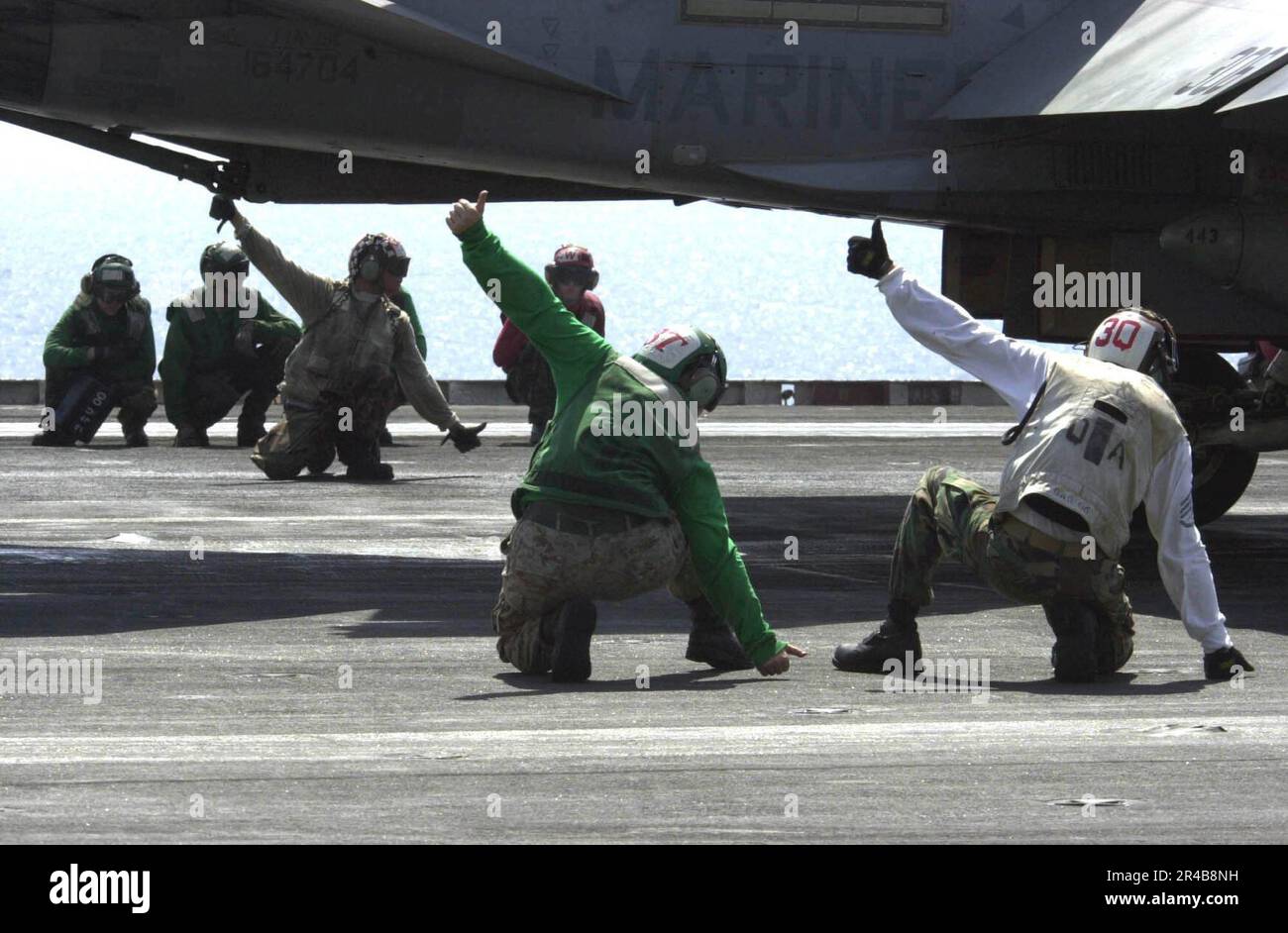 US Navy Squadron troubleshooters give the OK signal for an U.S. Marine ...