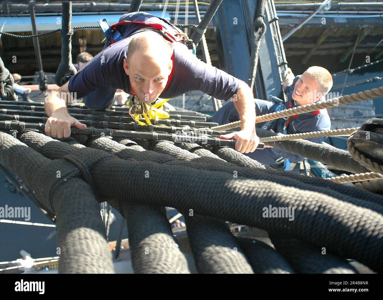 US Navy A chief petty officer (CPO) selectee climbs the rigging of the ...
