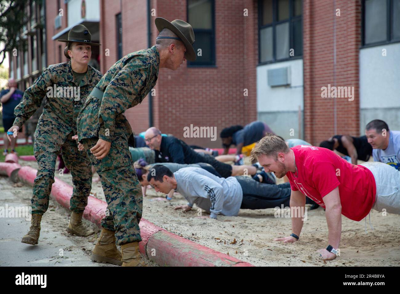 U.S. Marine Corps Sgt. Justin Fleming, center, and Sgt. Kayla Reyes ...