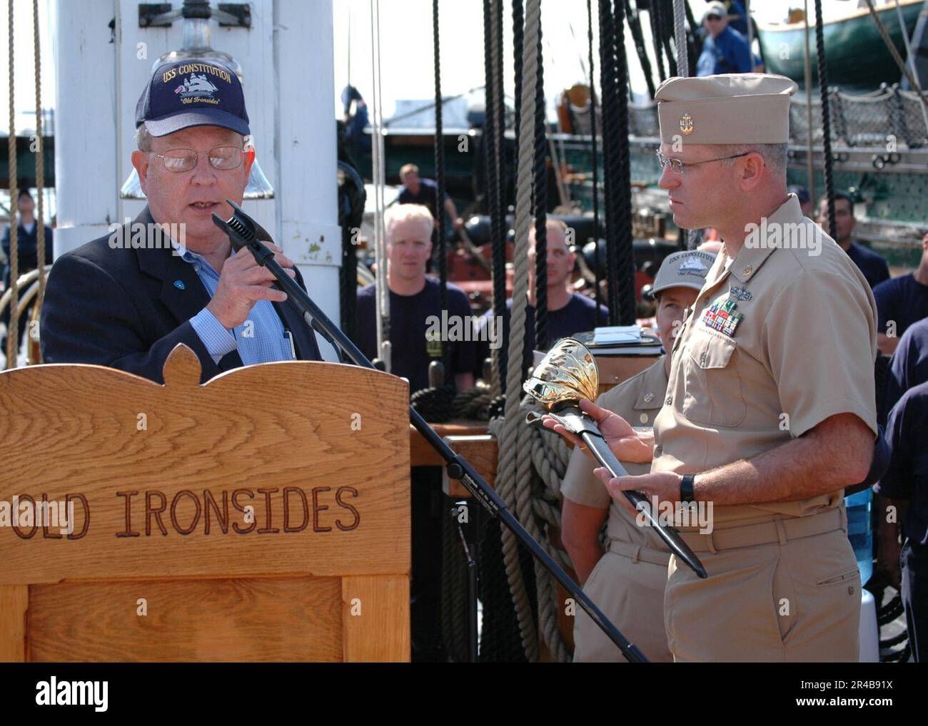 US Navy Senior Chief Quartermaster receives a customized naval cutlass ...