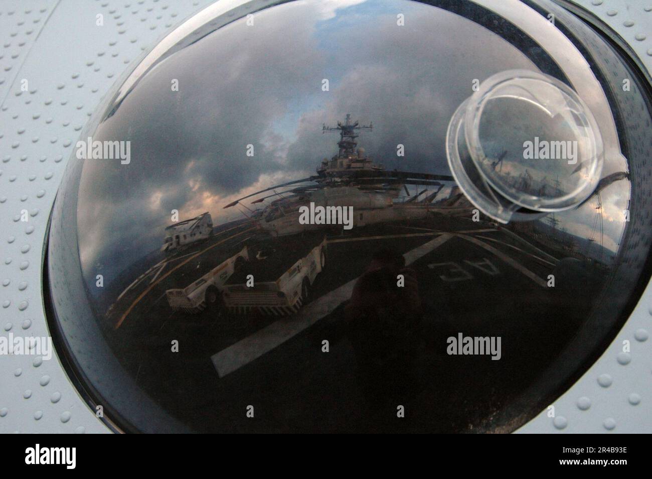 US Navy Photographers Mate 3rd Class takes a photo of an observation ...