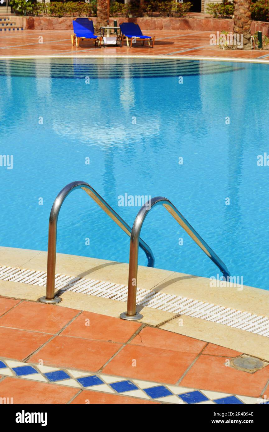 Swimming pool in touristic resort during summer time Stock Photo - Alamy