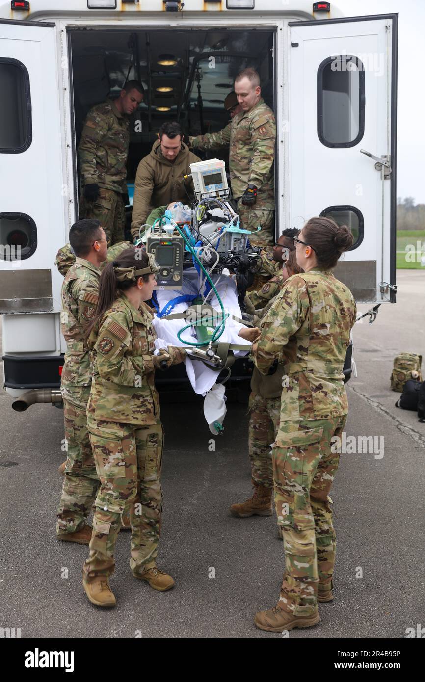 A U.S. Air Force critical care air transport team (CCATT) lifts a ...