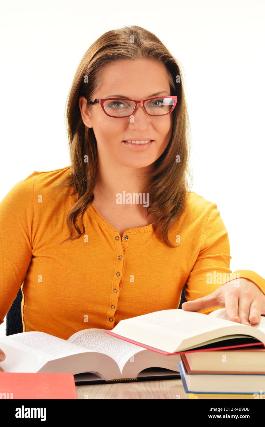 Young woman reading a book. Female student learning Stock Photo - Alamy