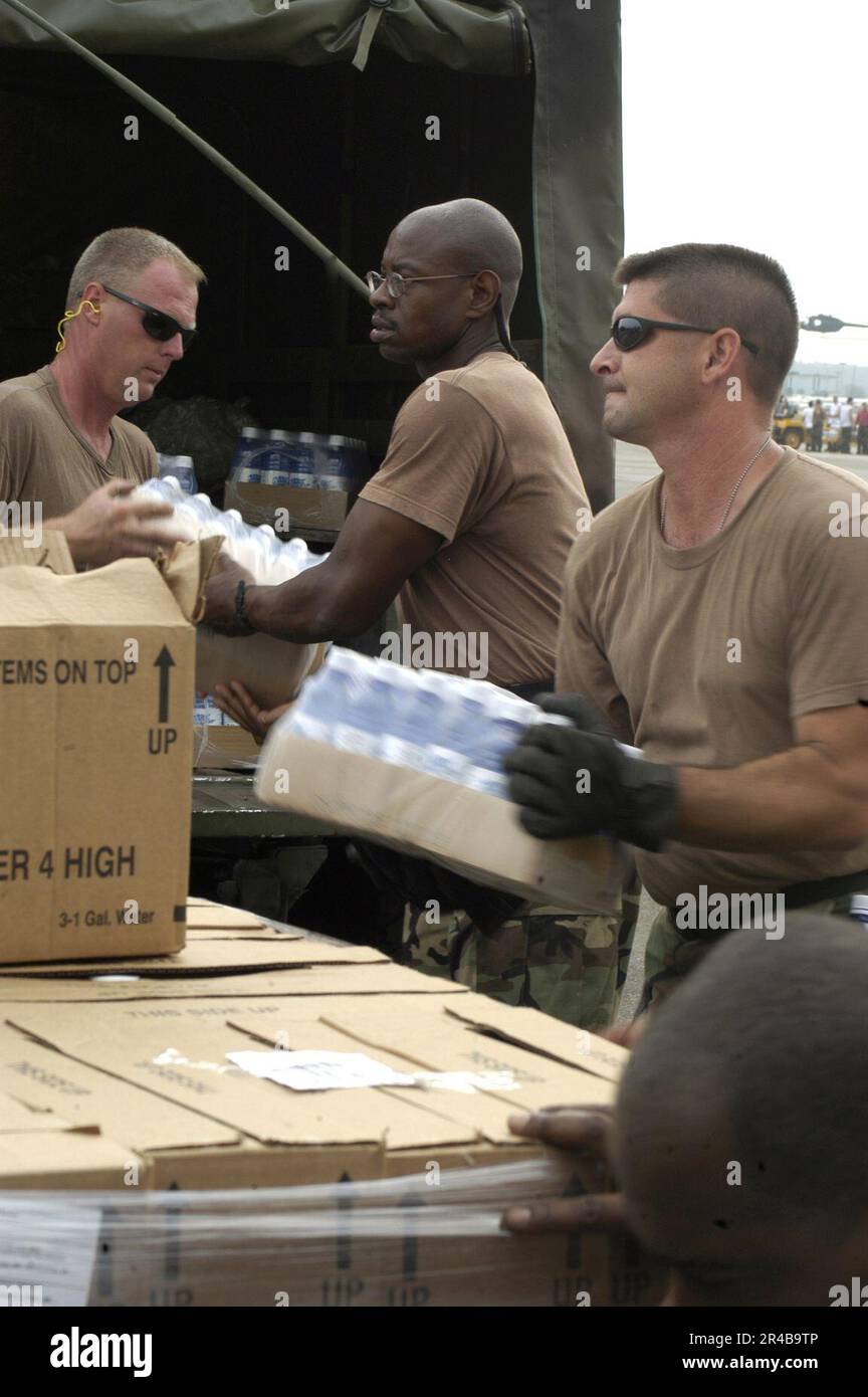 US Navy National Guardsmen from the Biloxi, Miss. area, load the back ...