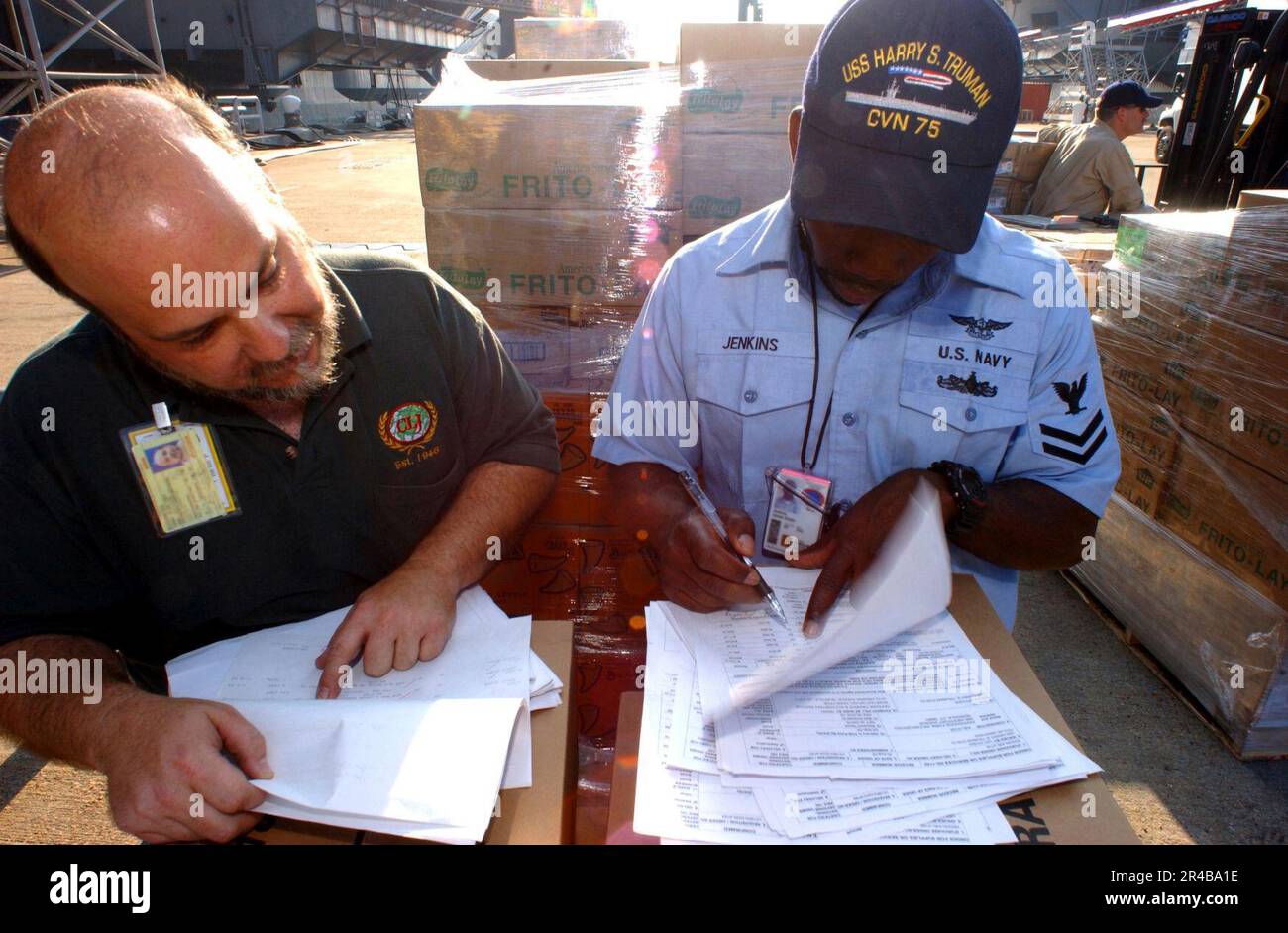 US Navy Ship's Serviceman 2nd Class takes inventory of the supplies ...