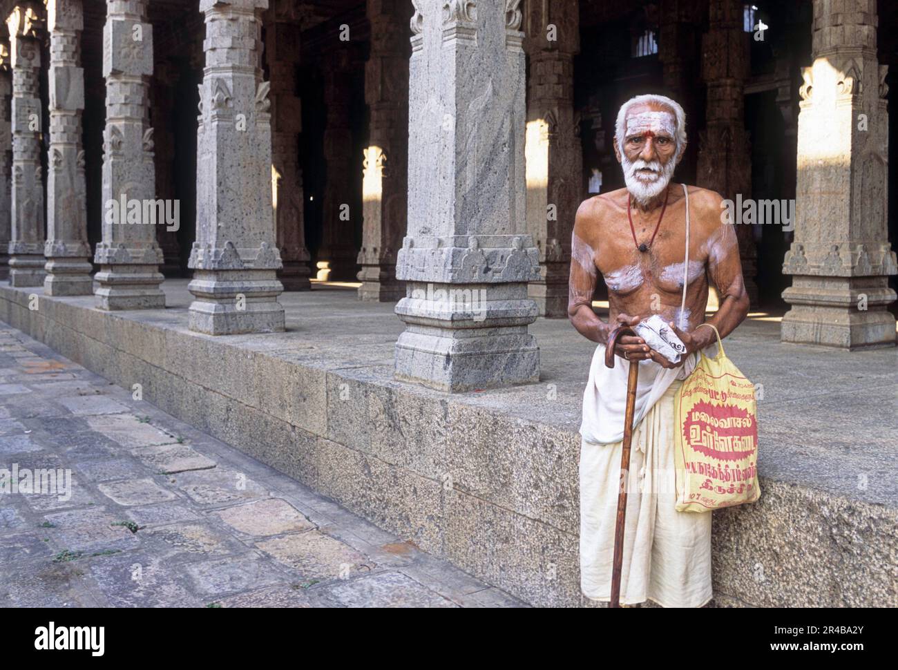A Brahmin devotee standing in Jambukeshwarar temple at Thiruvannaikaval ...