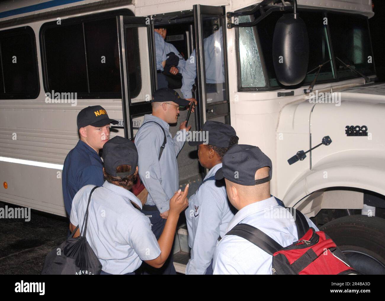 US Navy U.S. Navy medical personnel board buses as they depart Naval ...