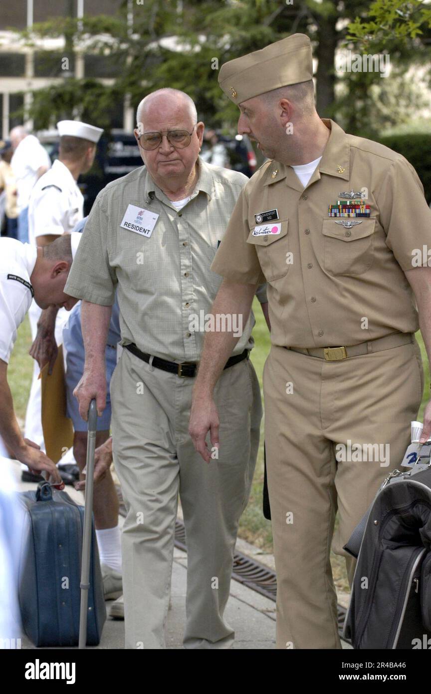 US Navy Chief Petty Officer escorts one of the many retired military ...