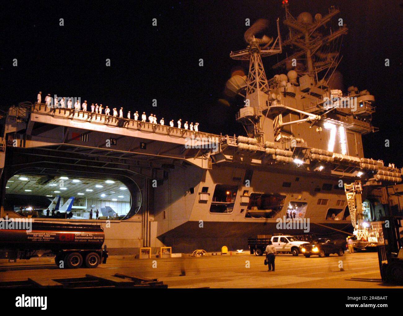 US Navy Sailors aboard the Nimitz-class aircraft carrier USS Theodore Roosevelt (CVN 71) man the ...