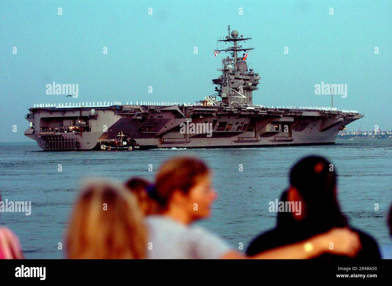 US Navy Family members of Sailors aboard the Nimitz-class aircraft carrier USS Theodore ...