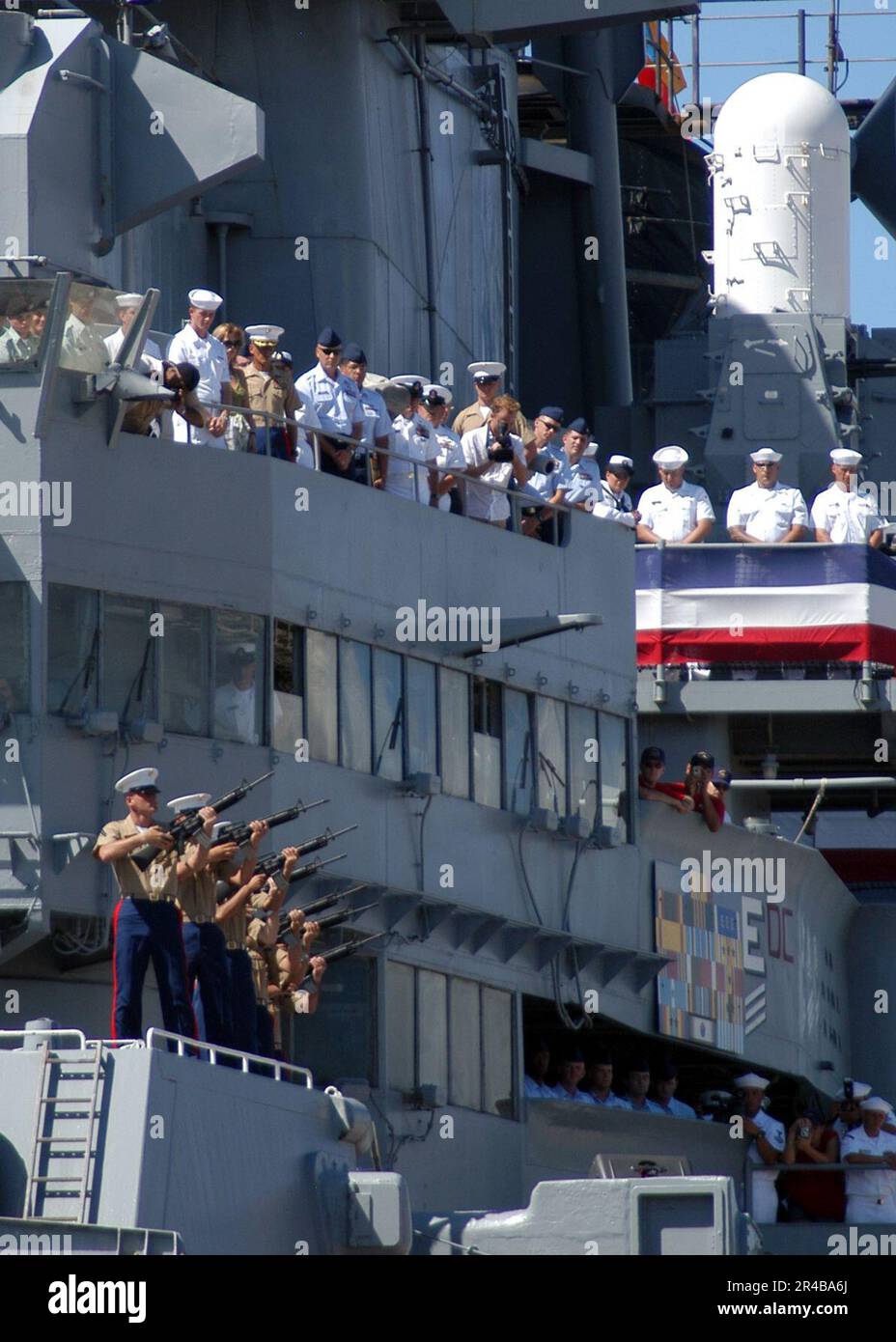 US Navy A U.S. Marine Corps rifle detail fires off a salute during the ...