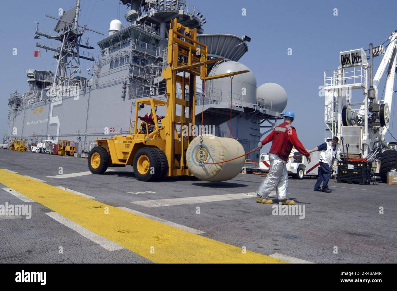 US Navy Crash and Salvage crew members aboard amphibious assault ship ...