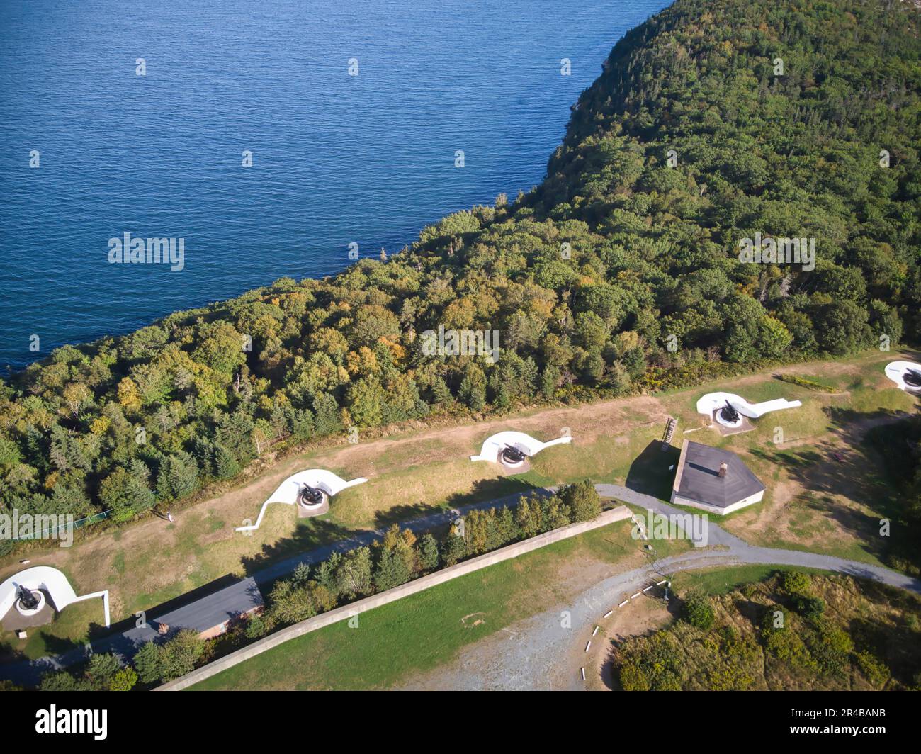 An aerial shot of a large concrete building in the shape of an oval ...