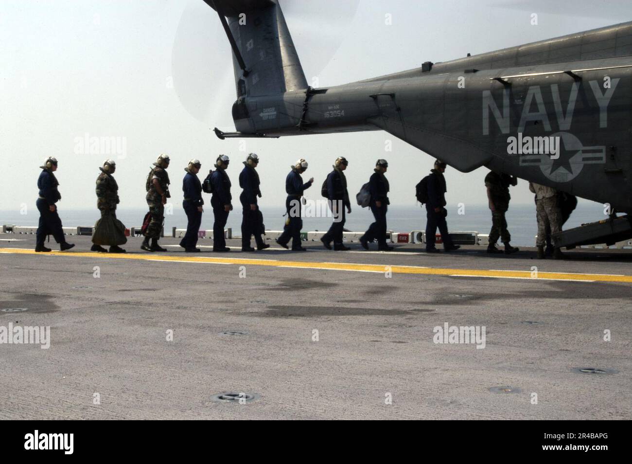 US Navy Medical personnel depart the amphibious assault ship USS Bataan ...