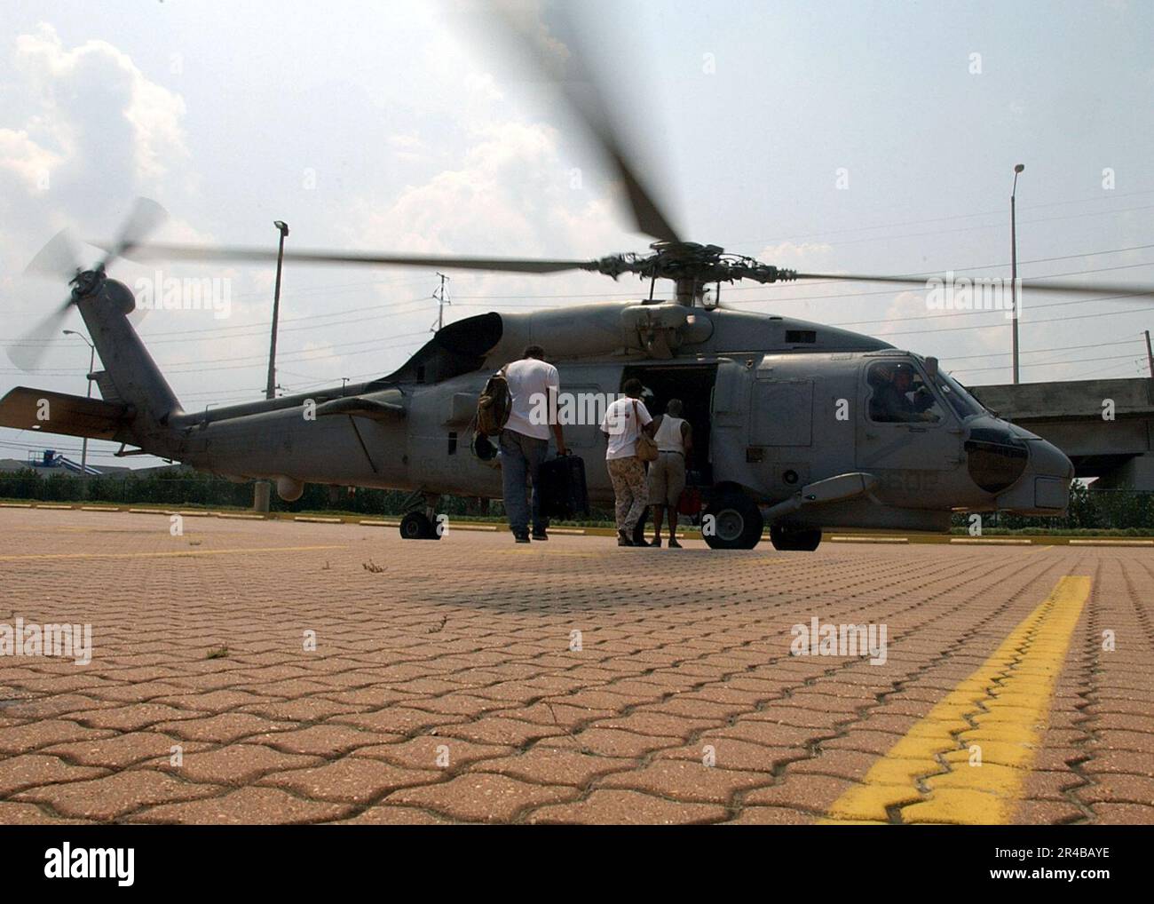 US Navy Hurricane Katrina victims board a U.S. Navy SH-60B Seahawk ...