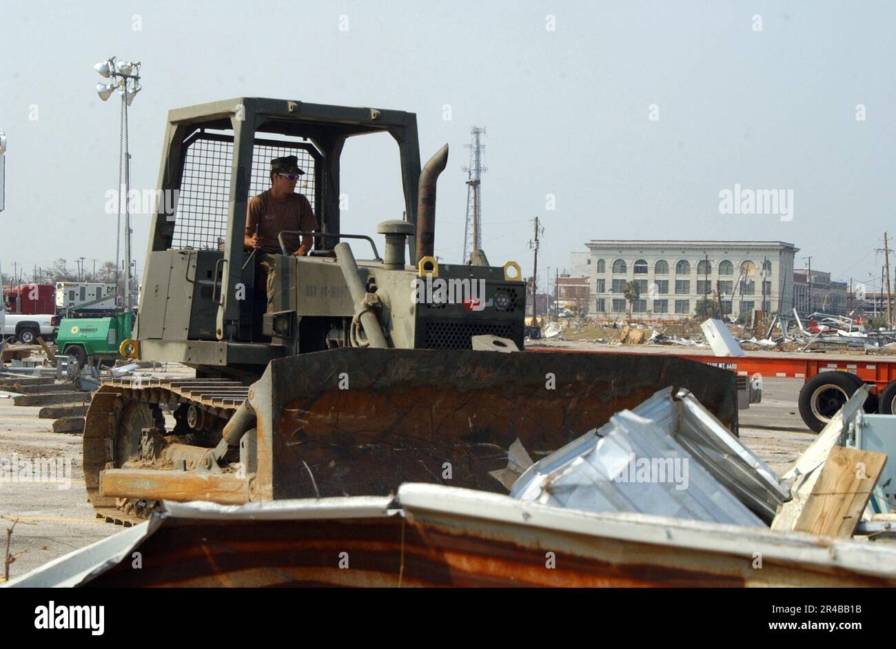 US Navy A U.S. Navy equipment operator assigned to Naval Mobile ...