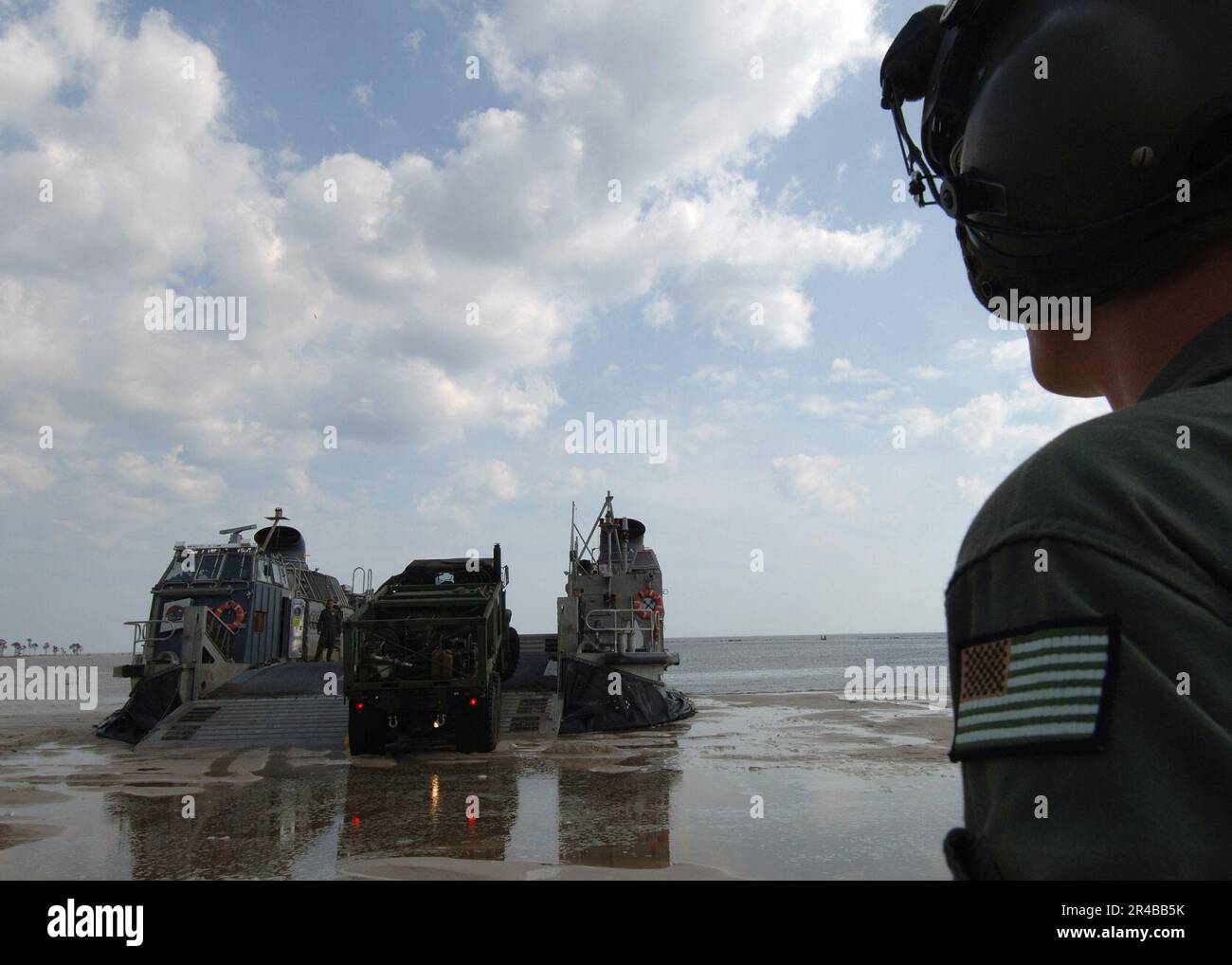 US Navy A U.S. Marine Corps 7-ton truck is offloaded from a U.S. Navy ...
