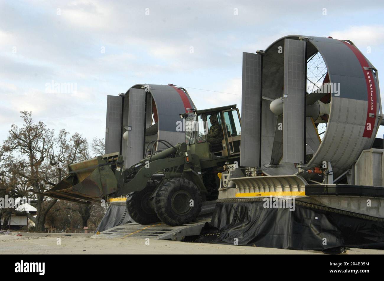 US Navy A U.S. Marines Corps front-end loader is driven off a U.S. Navy ...
