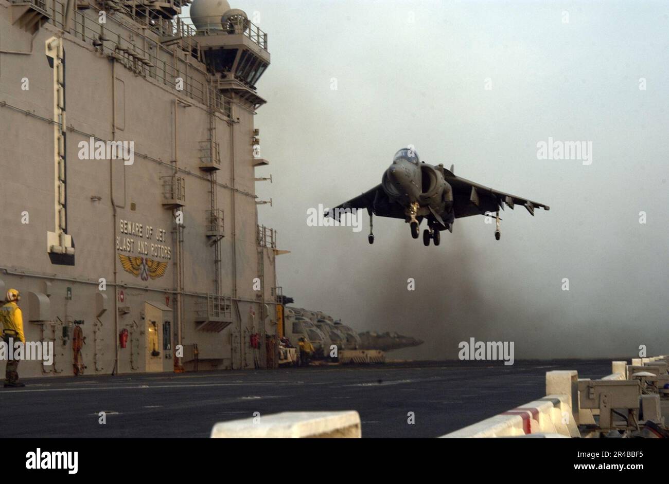 US Navy A U.S. Marine Corps AV-8B Harrier lands on the flight deck ...