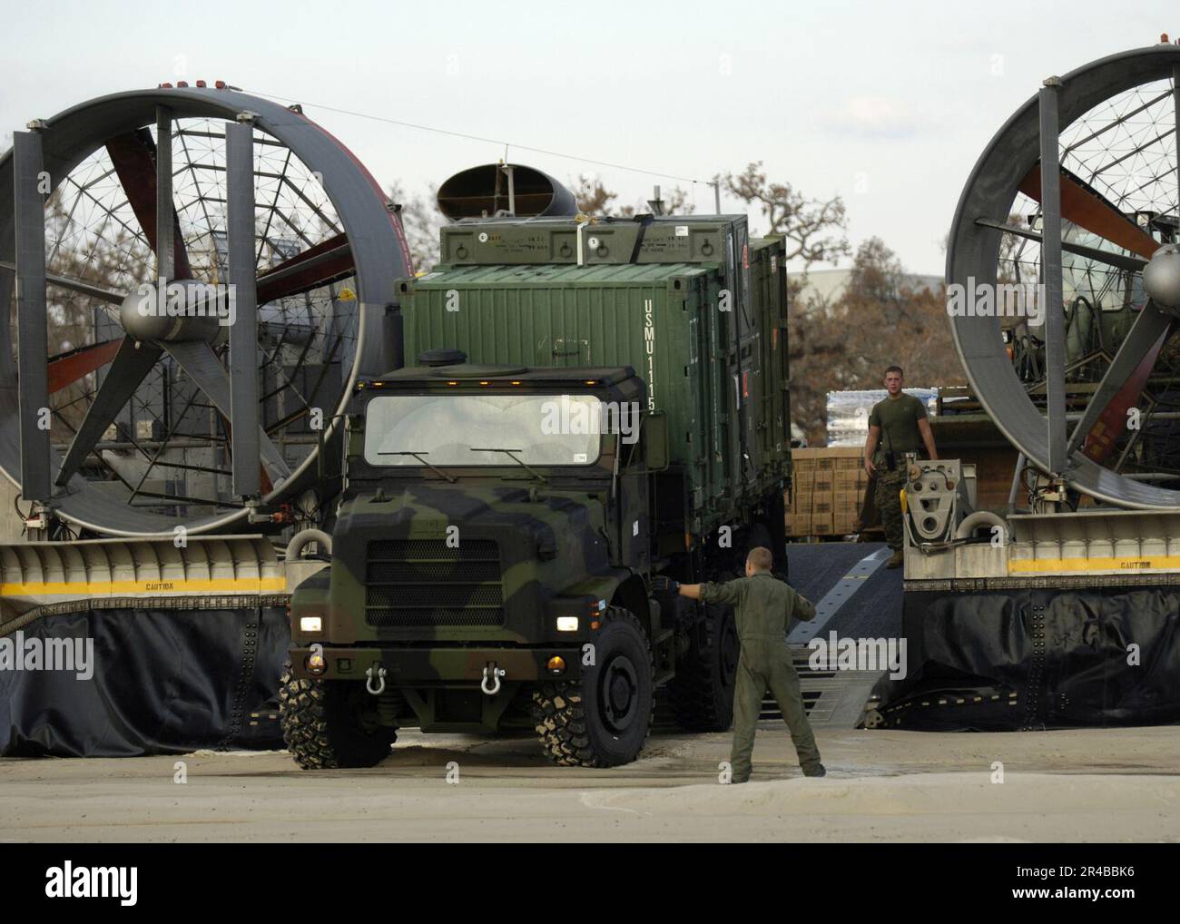 US Navy A U.S. Marine Corps 7-ton truck is offloaded from a U.S. Navy ...