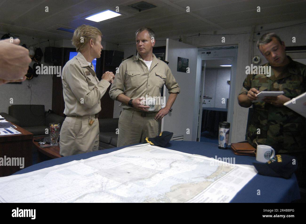 US Navy Commanding Officer, USS Bataan (LHD 5), Capt. left, speaks with ...
