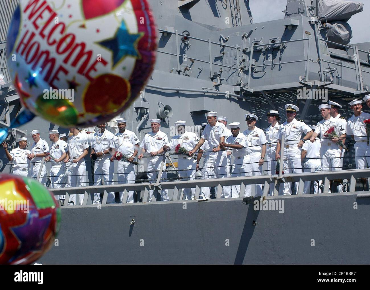 US Navy Sailors man the rails aboard the guided missile destroyer USS ...