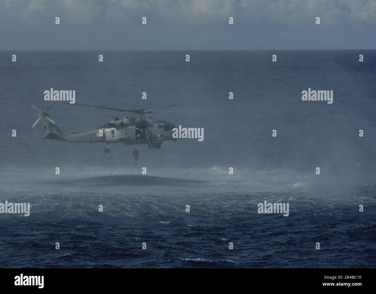 US Navy A member assigned to Explosive Ordnance Disposal Mobile Unit ...