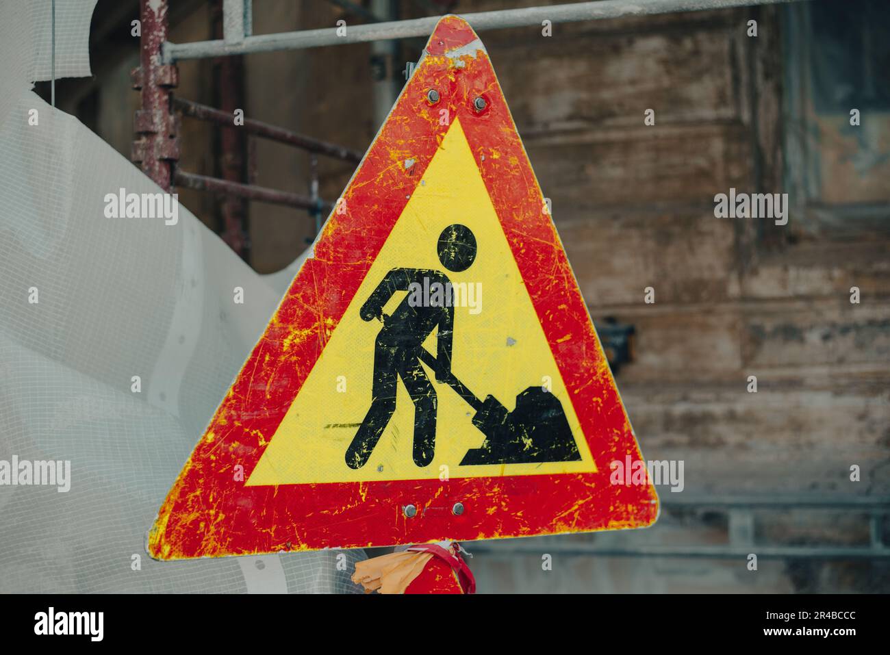 An old street work sign at the construction site Stock Photo - Alamy